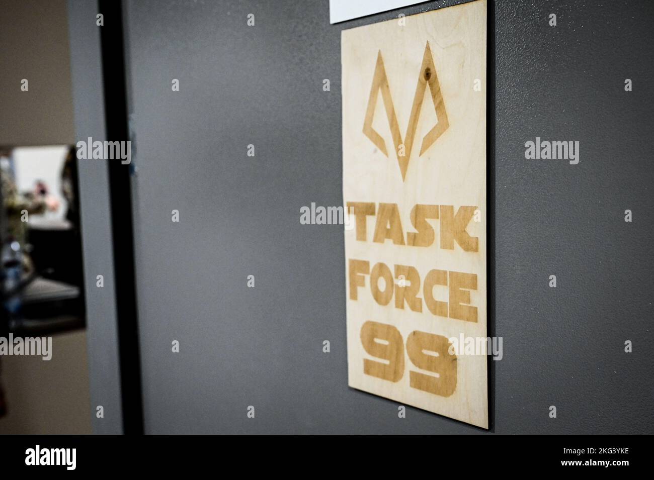 A Task Force 99 sign hangs on the door to the team’s work center at Al ...