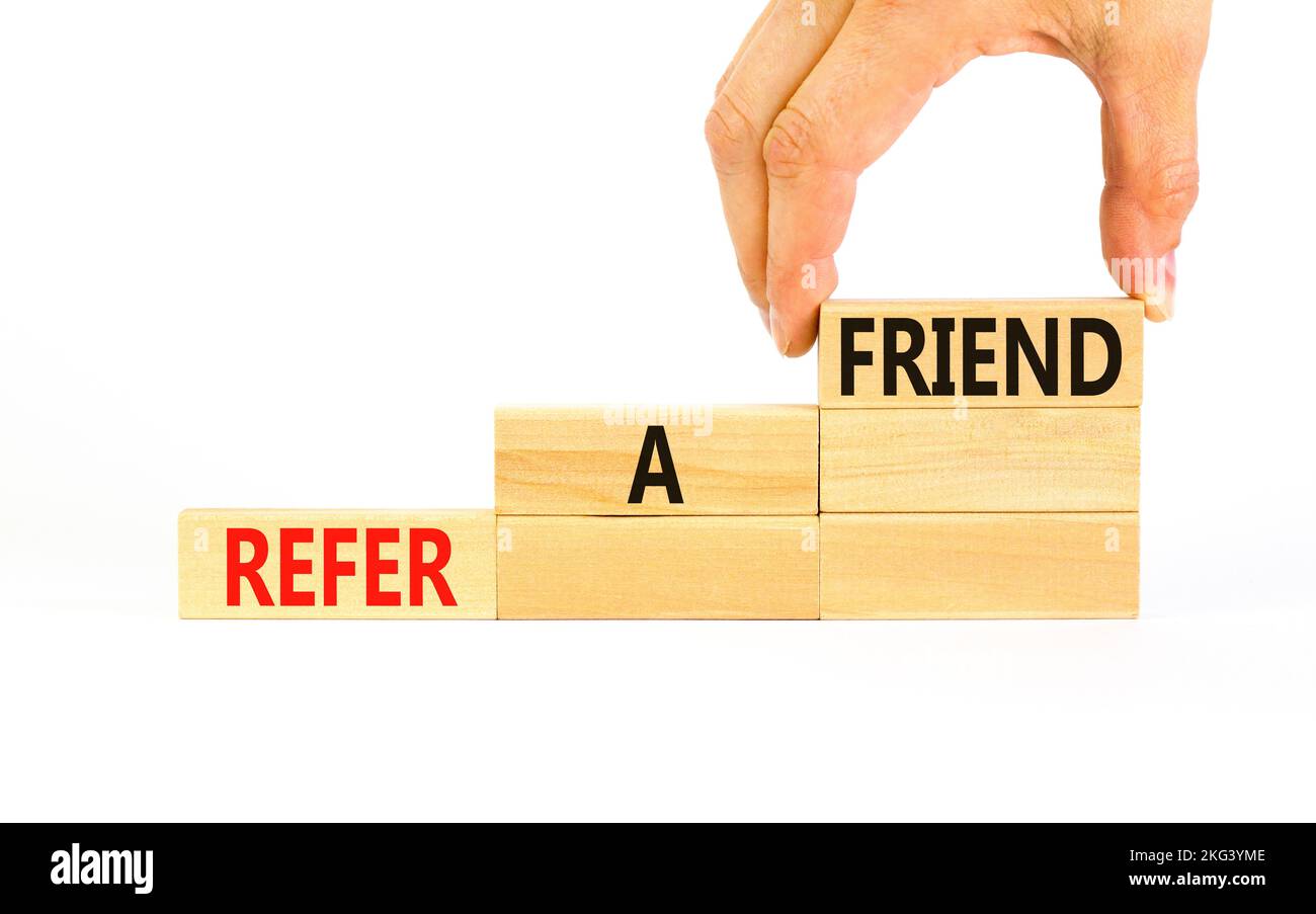 Refer a friend symbol. Concept words Refer a friend on wooden blocks on ...
