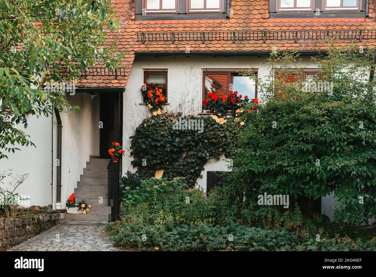 Traditional small house with beautiful outdoor decor facade in Germany ...