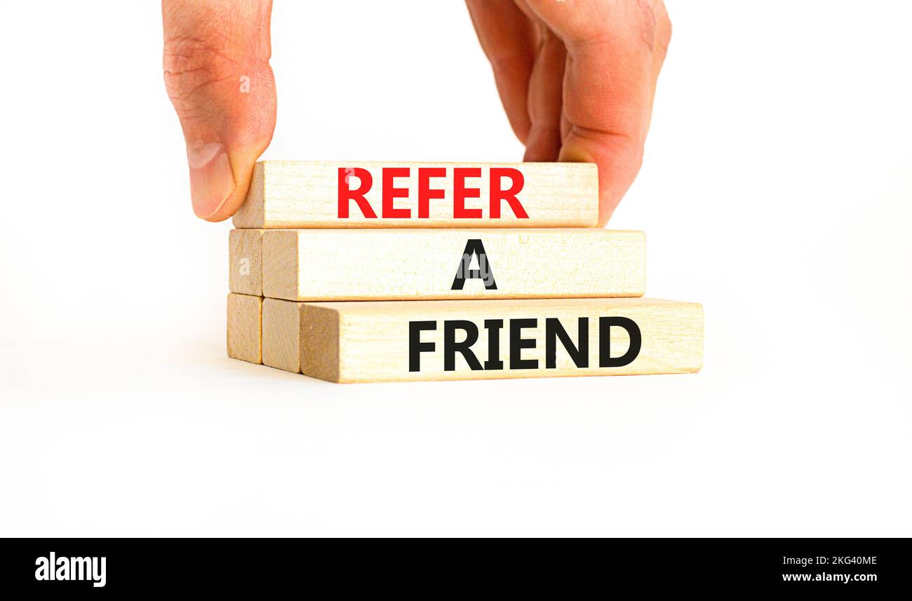 Refer a friend symbol. Concept words Refer a friend on wooden blocks on ...
