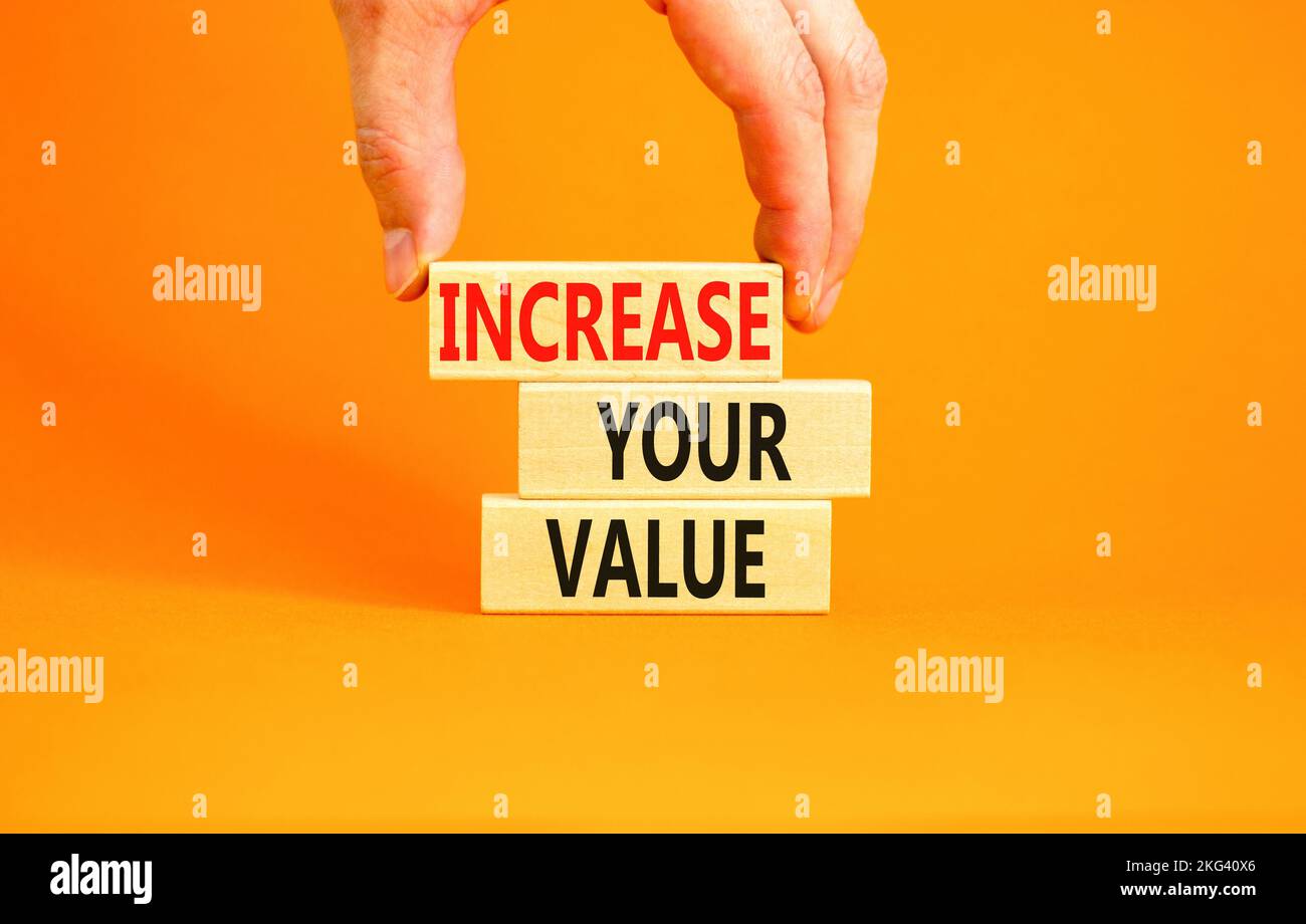 Increase your value symbol. Concept words Increase your value on wooden ...