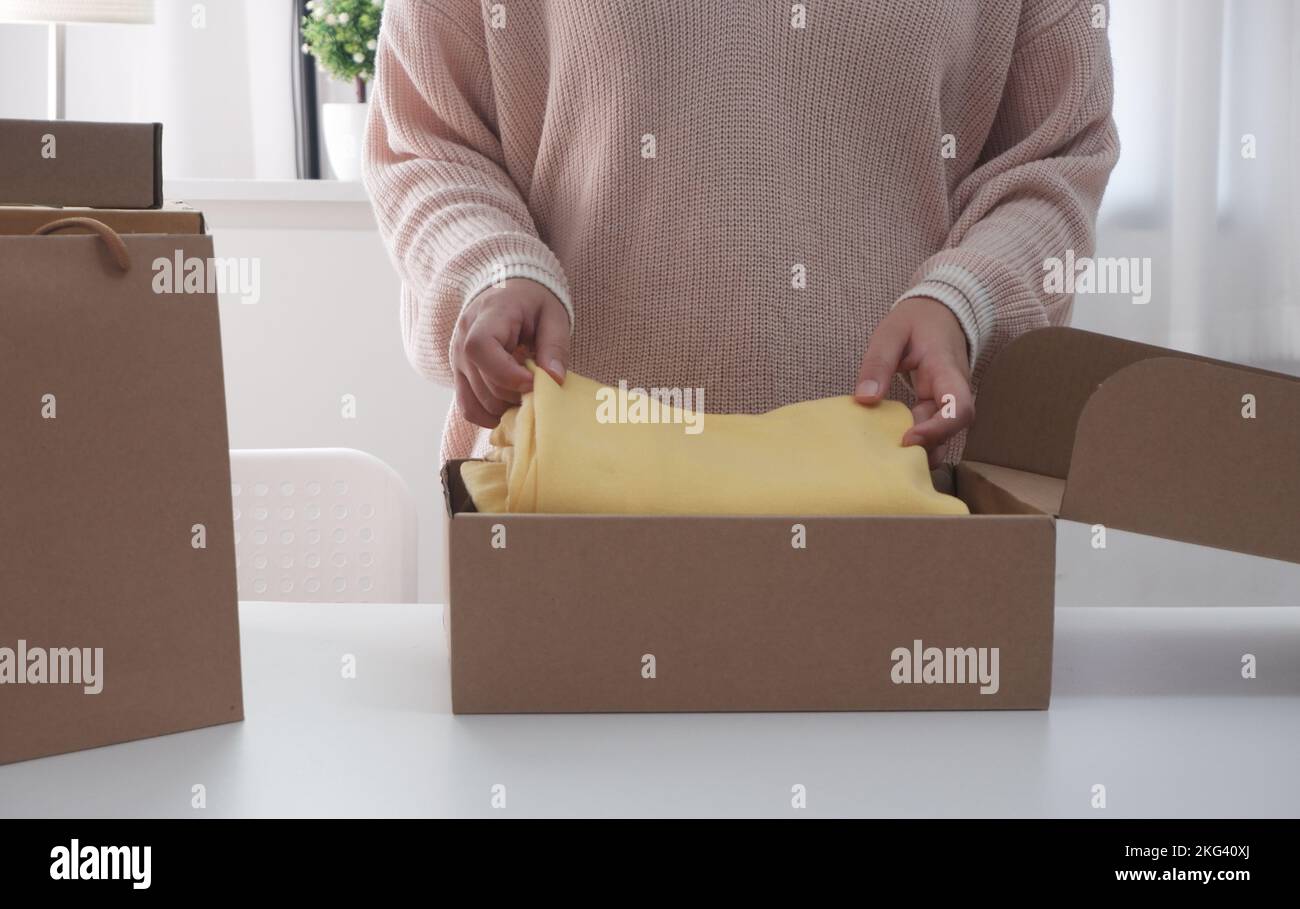 Women packing Cardboard Parcel Box for Online Selling. Woman Seller ...