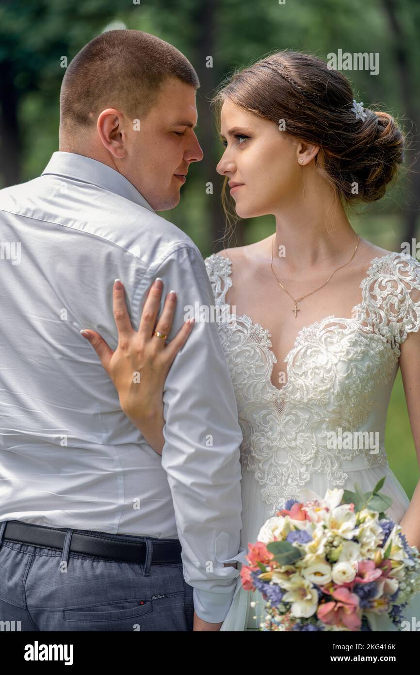 bride and groom look into each other's eyes Stock Photo - Alamy