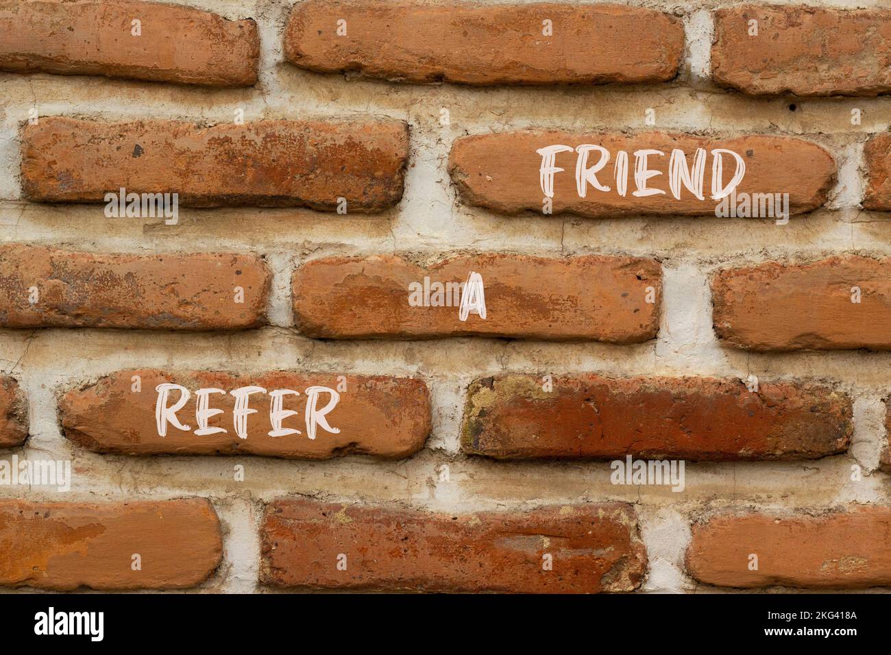 Refer a friend symbol. Concept words Refer a friend on brick wall ...
