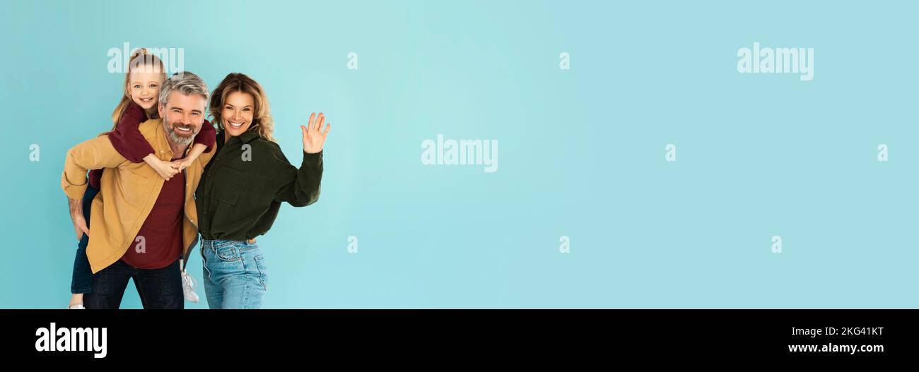 Beautiful Happy Family Of Three Posing Over Blue Studio Background ...