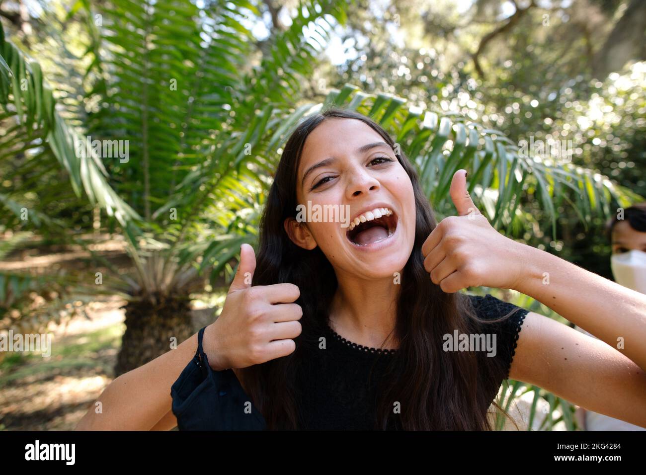 Teen girl thumbs up hi-res stock photography and images - Alamy