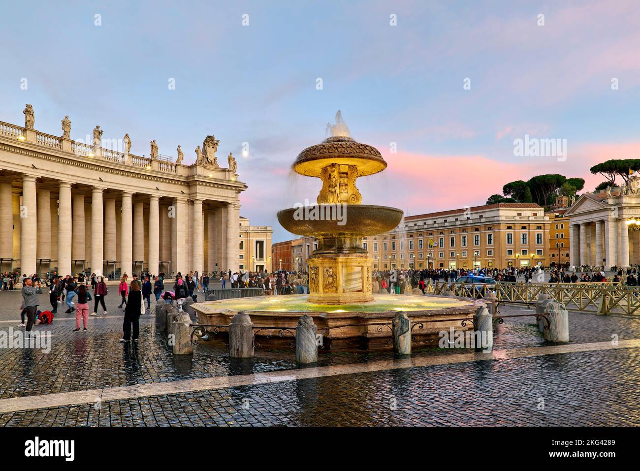 Rome Lazio Italy. Saint Peter's Square at dusk. The fountain by Bernini ...