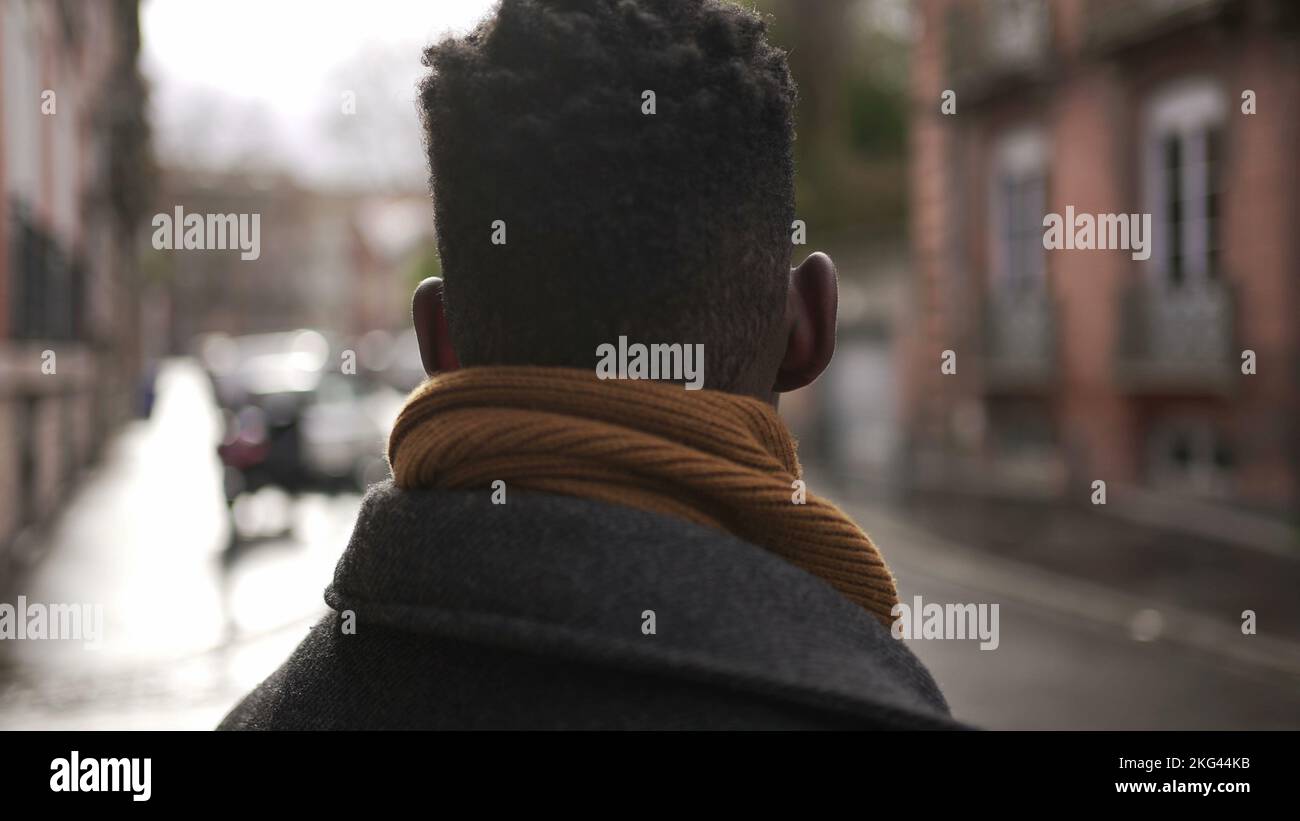Pensive black man standing outside in city downtown. Thoughtful African ...
