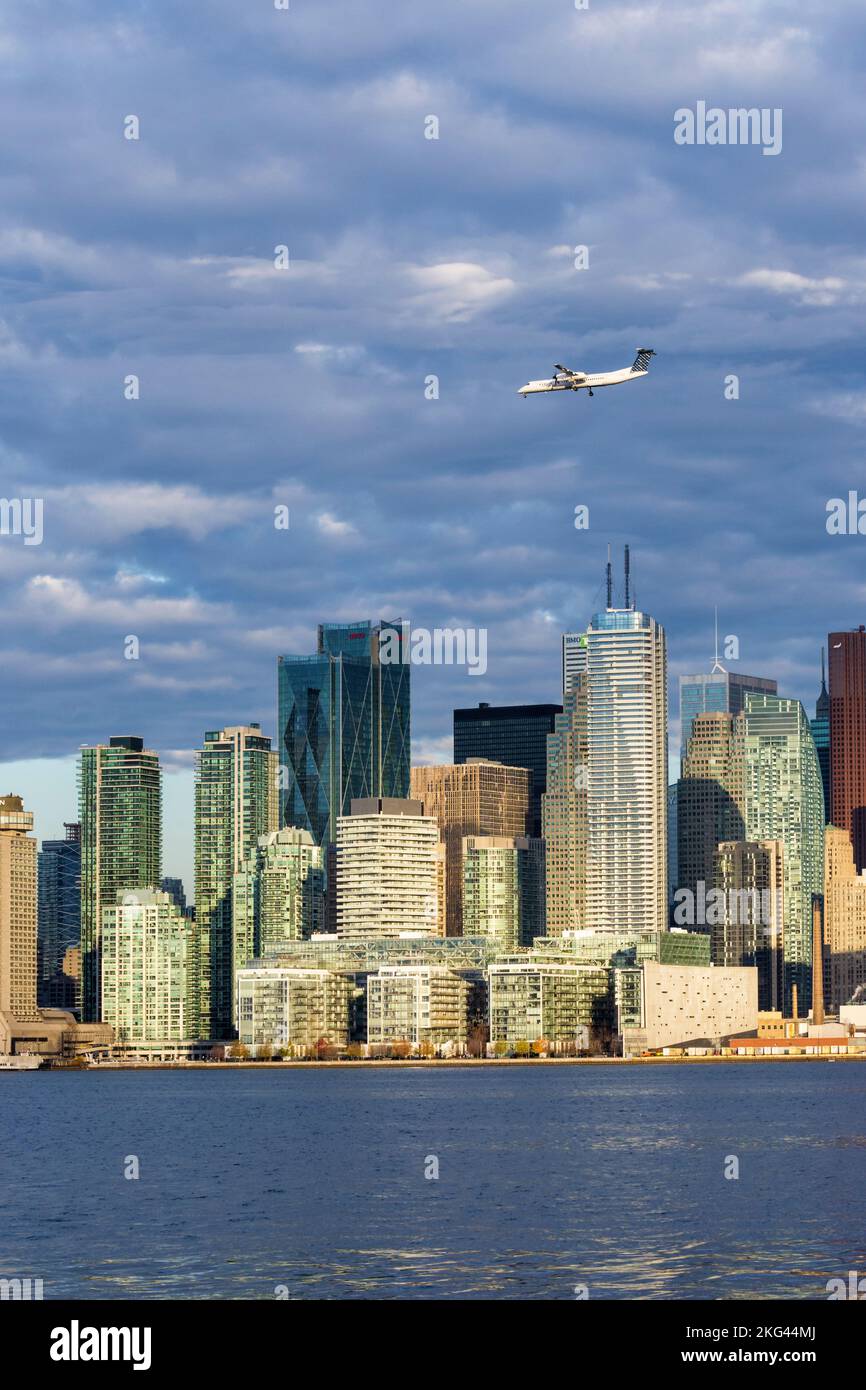 Airplane flying over Toronto skyline, Toronto downtown, Ontario, Canada ...