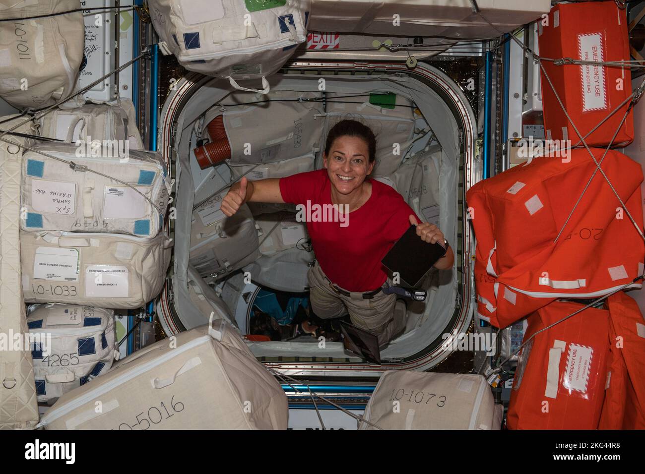 NASA astronaut Nicole Mann gives a thumbs up inside the Harmony module's forward-facing docking ...