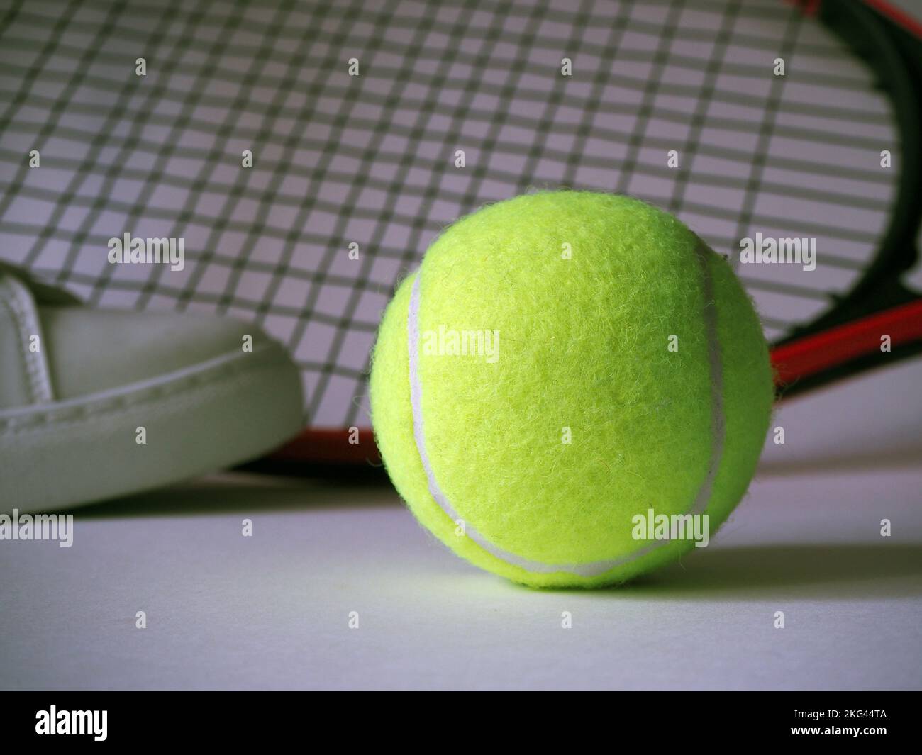 Tennis ball on sports material background Stock Photo - Alamy