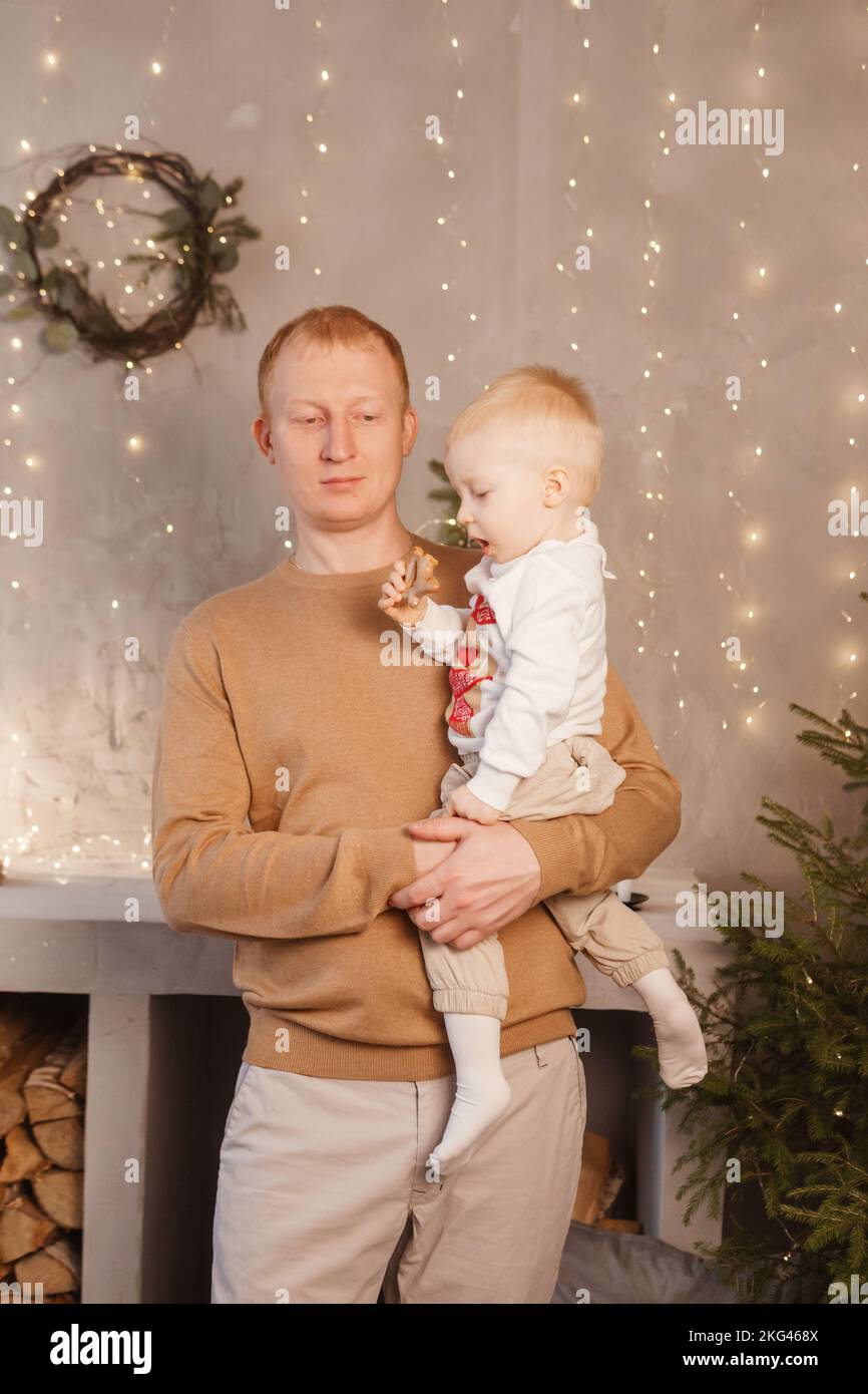 Dad and his little son in a magical Christmas atmosphere. The concept ...