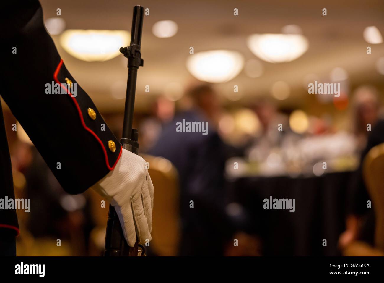 A U.S. Marine with the Marine Corps Base Quantico color guard prepares ...