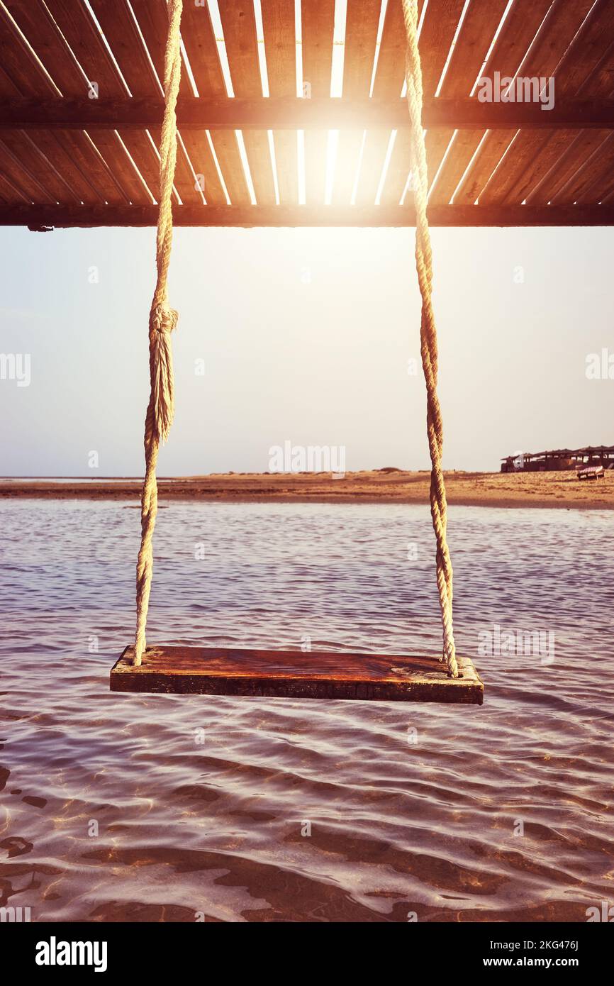 Old wooden swing beach hi-res stock photography and images - Alamy