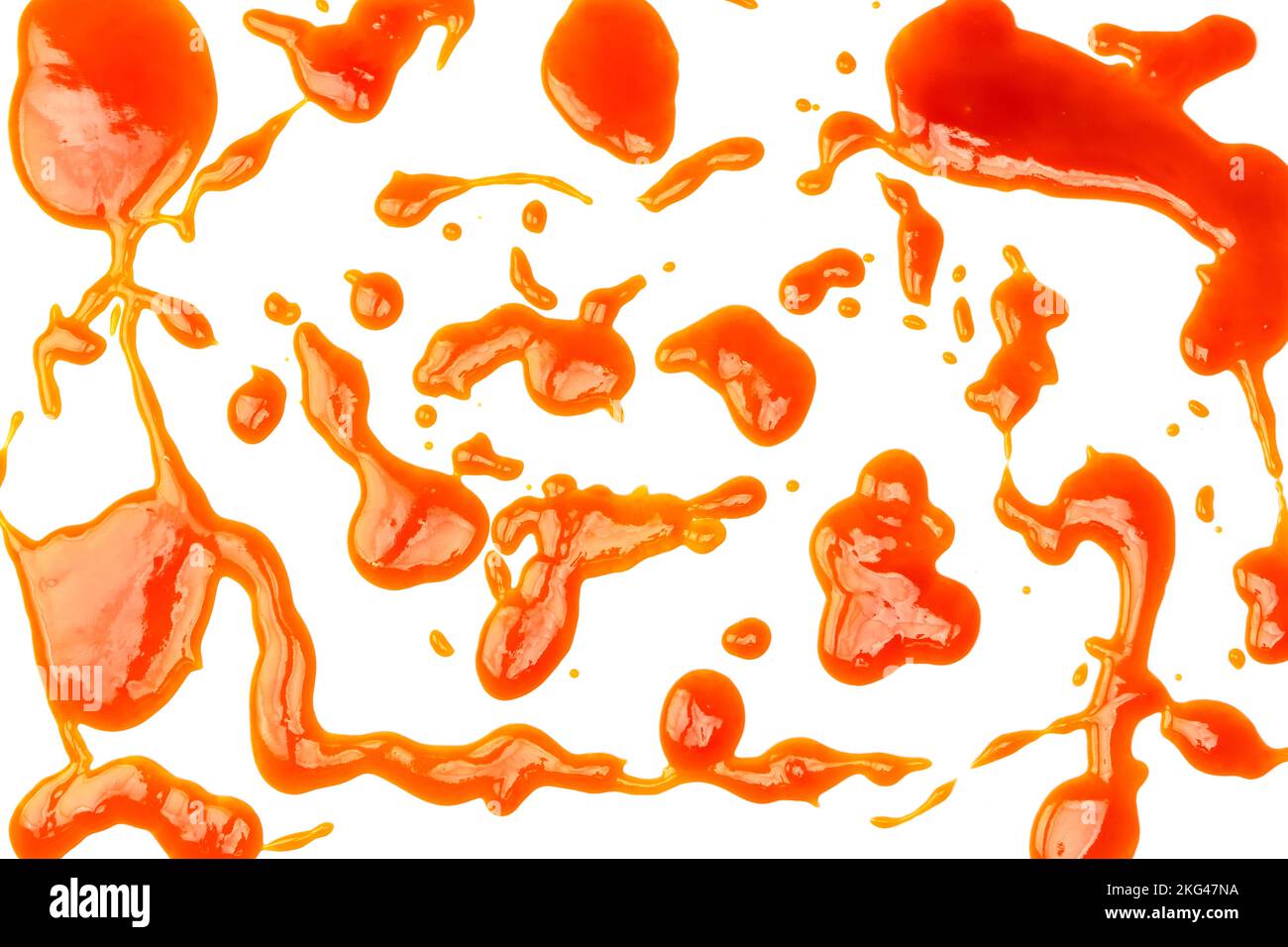 Orange sauce splashes isolated on white a background. Top view Stock ...
