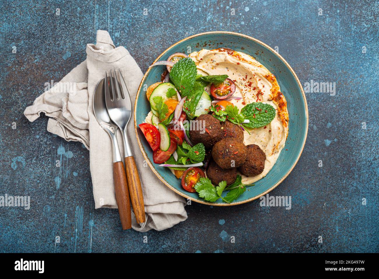 Middle Eastern Arab meal with fried falafel, hummus, vegetables salad ...