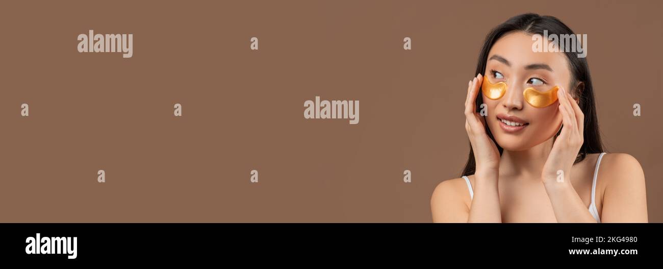 Beautiful Smiling Korean Woman With Patches Under Eyes Looking At Copy ...