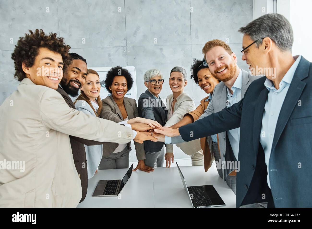 Group business people holding hands hi-res stock photography and images - Alamy