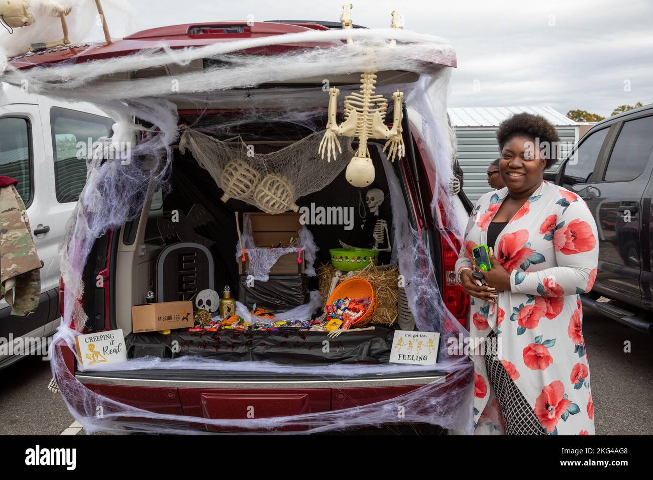 Ms. Rodgers of the Property Book Office showing off the trunk she ...