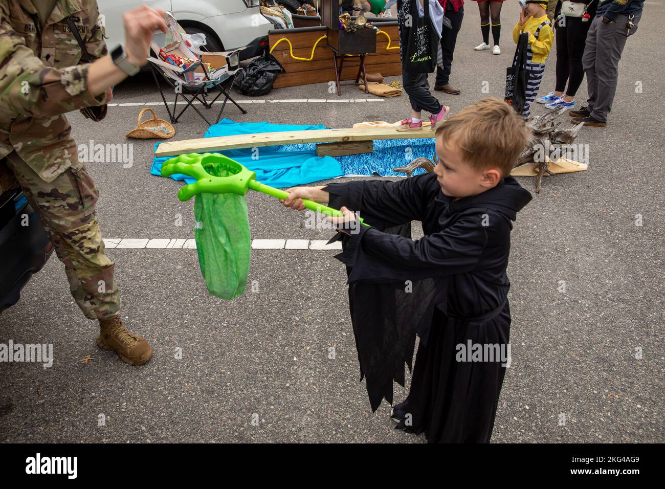 A trick or treater getting some candy during the XVIII Airborne Corps ...
