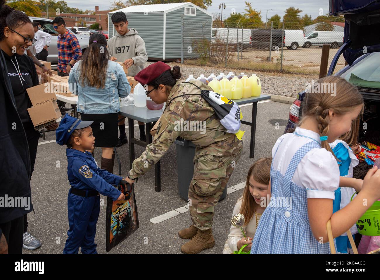 An U.S. Army Soldier giving a young child candy during the XVIII ...
