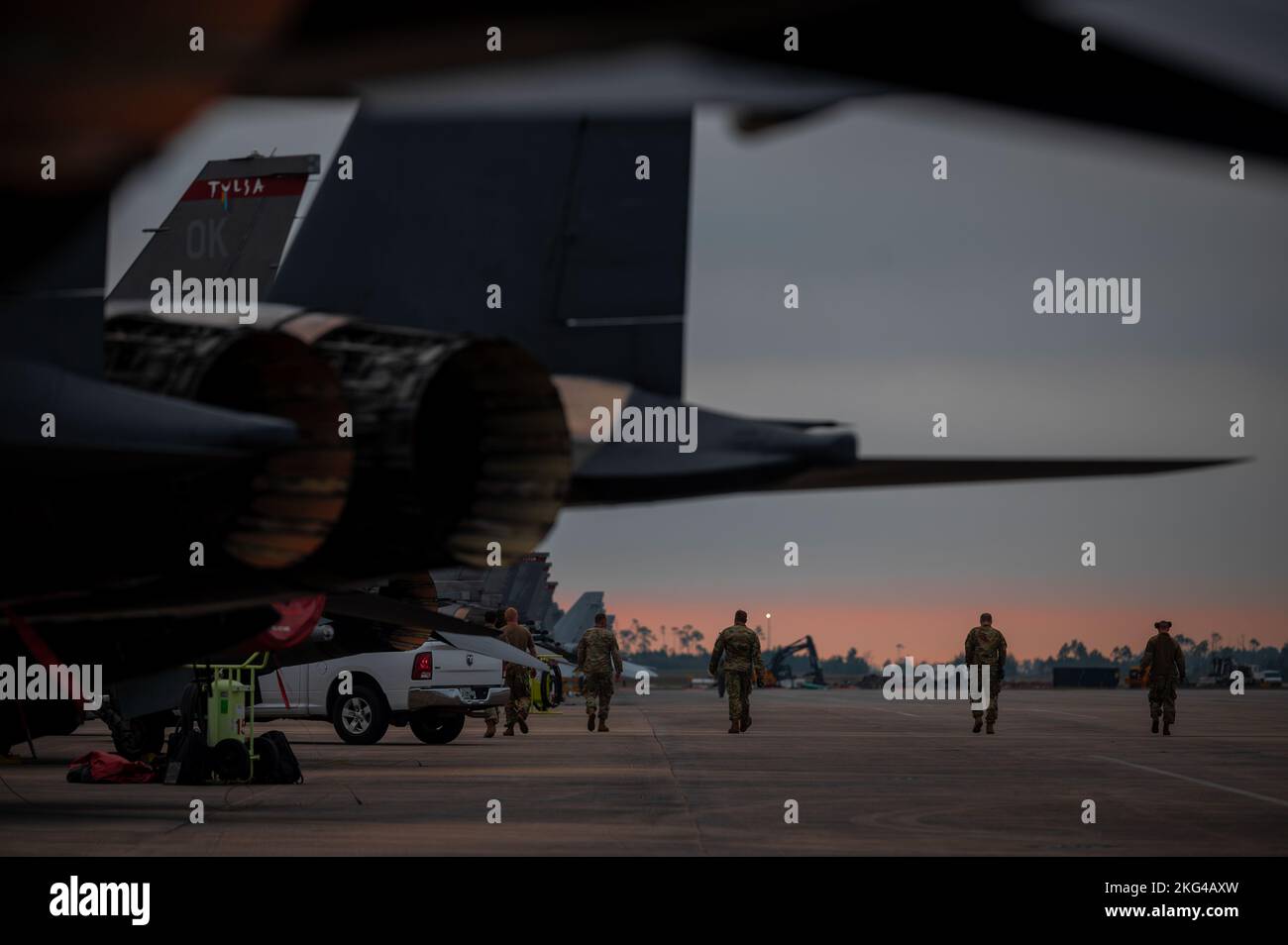 U.S. Airmen perform a foreign object debris walk before the flight line ...