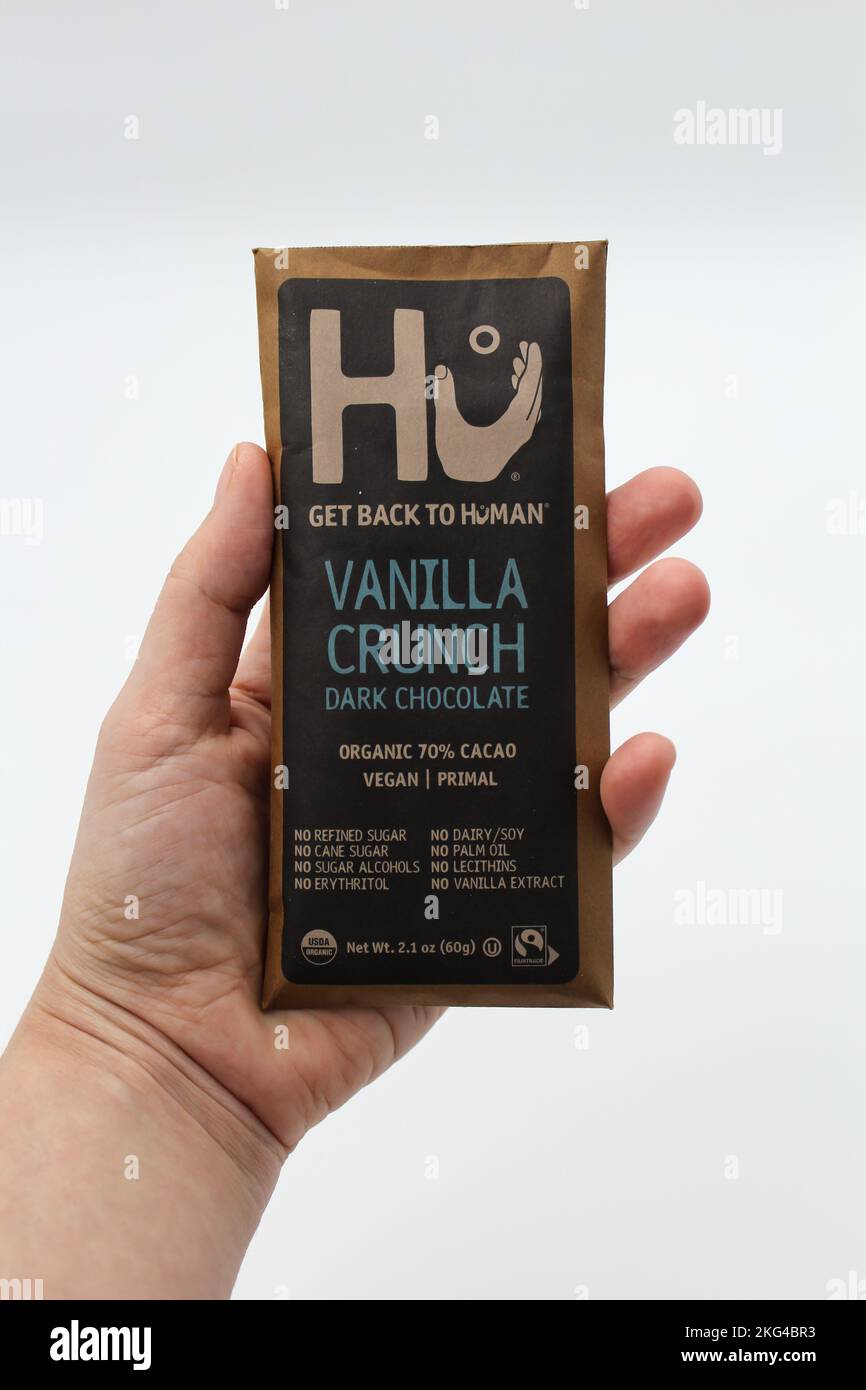 Person holding a Hu brand chocolate bar. Get Back to Human is the ...