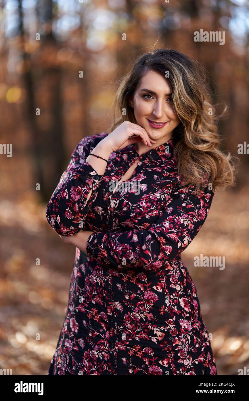 Plus size beautiful woman in an oak forest in the late autumn Stock ...