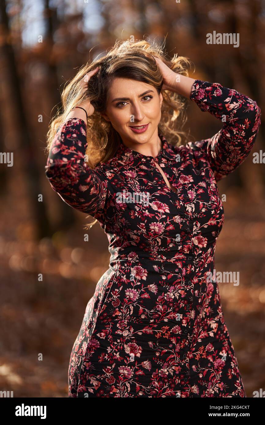 Plus size beautiful woman in an oak forest in the late autumn Stock ...