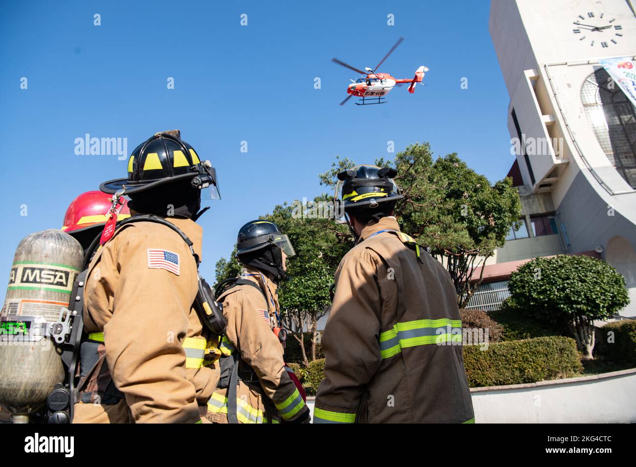 Airmen from the 8th Civil Engineer Squadron fire services flight, watch ...