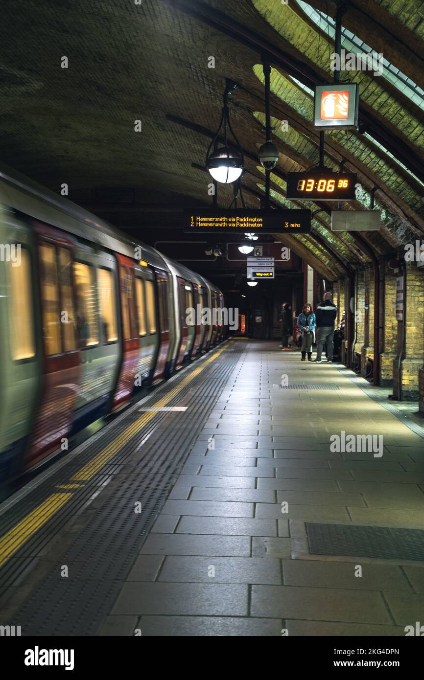 A vertical view of a London Underground subway station with a train ...