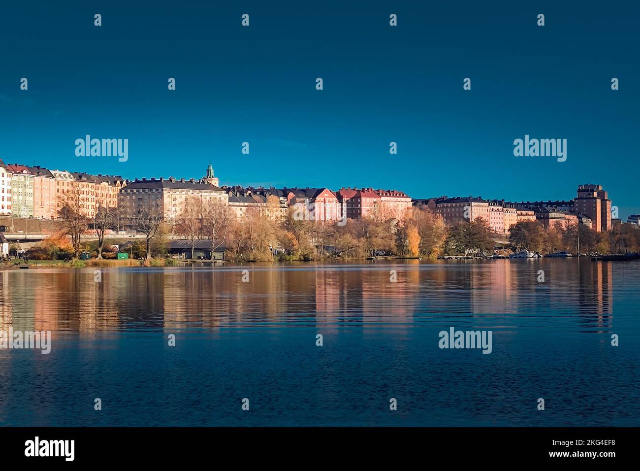 A beautiful shot of historic buildings on the shore of the water in ...