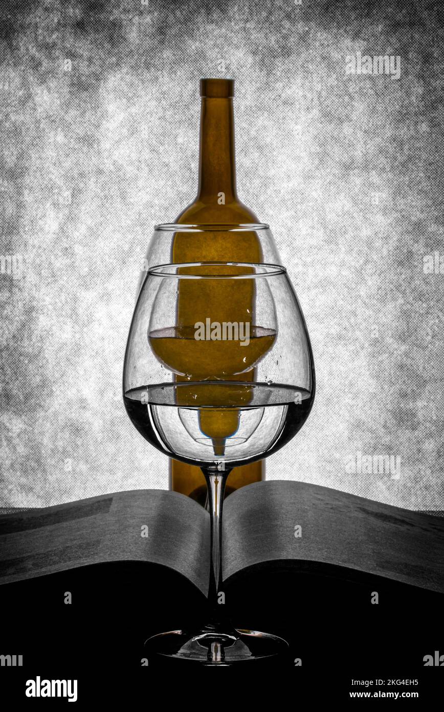 Still life with a book, an empty bottle and glasses with liquid Stock ...