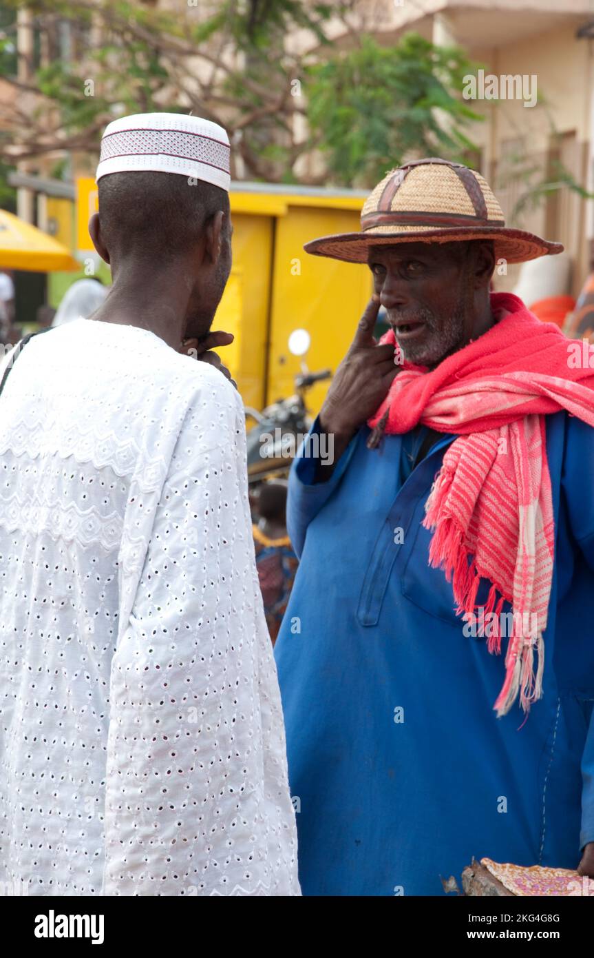 Men in African dress chatting on the street, Natitingou, Atacora, Benin ...