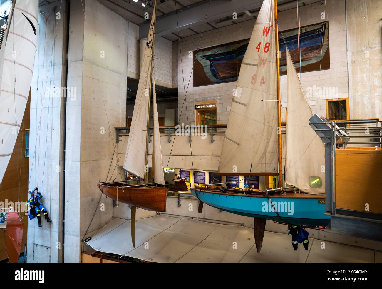 A selection of wooden yachts hanging on display at the National Maritime Museum, Cornwall, in ...