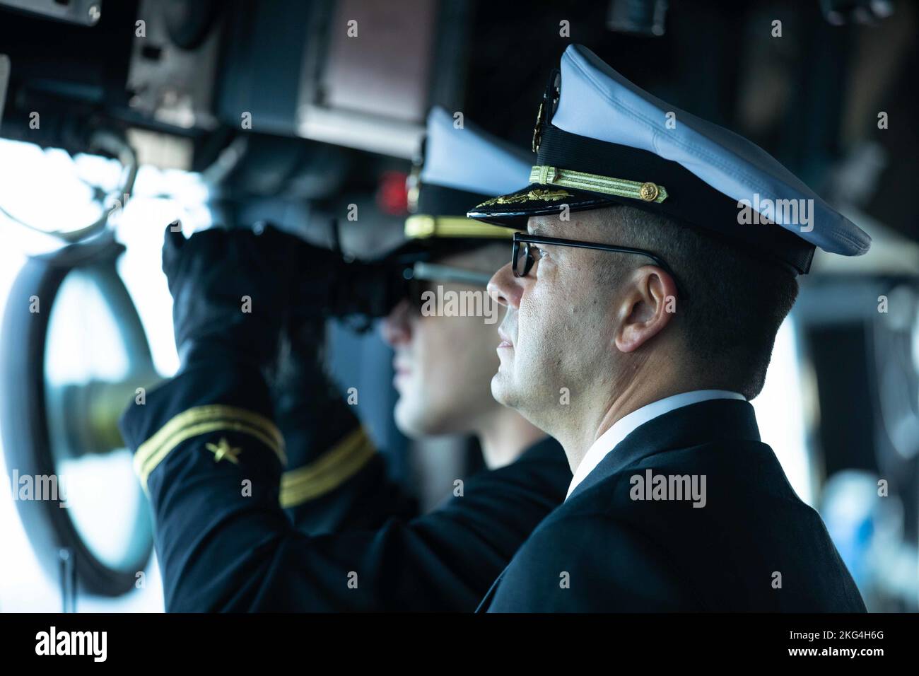 Capt. Simon McKeon, commanding officer, USS Normany, right, and Ens ...