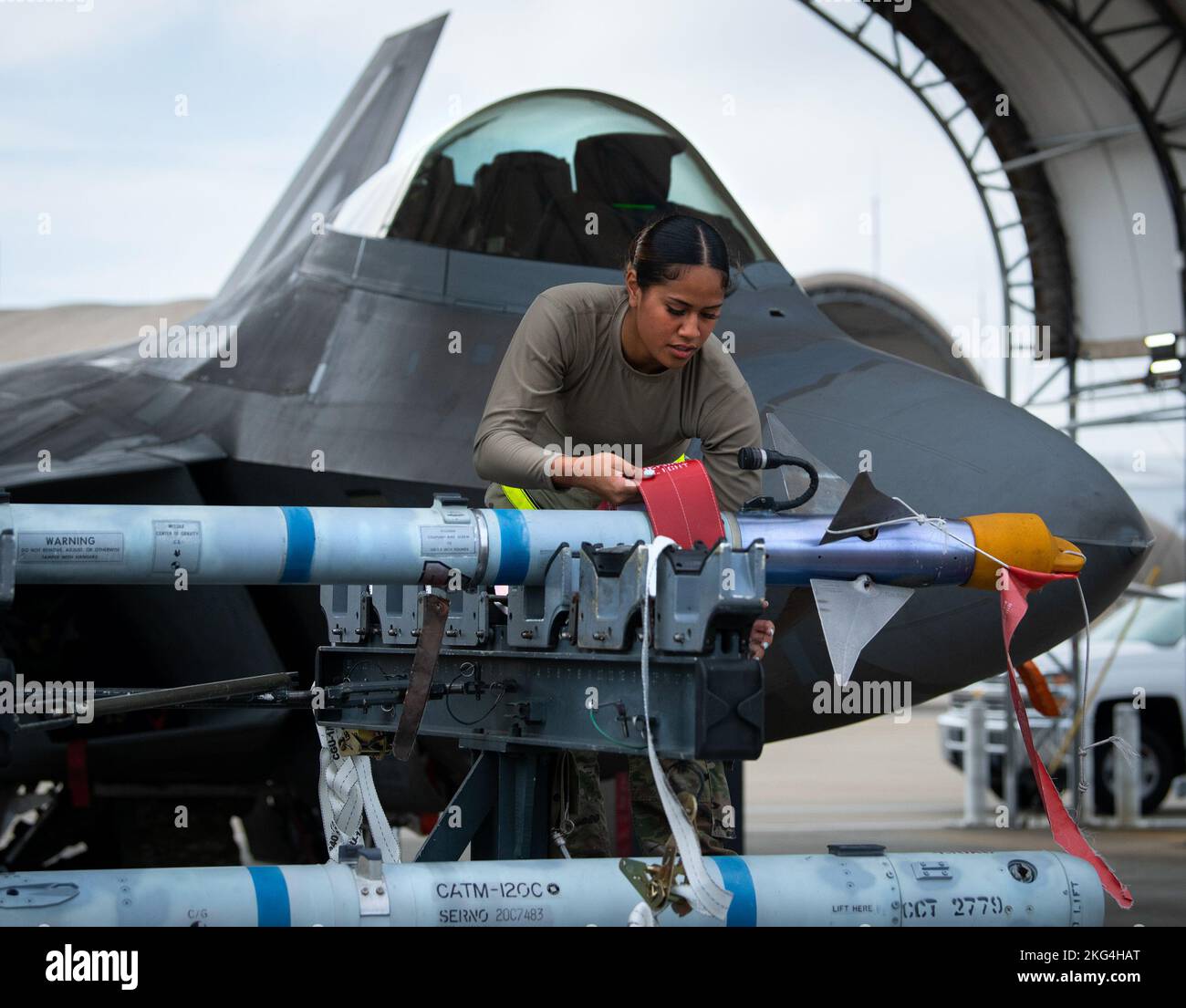 Airman Leata Kisena, 43rd Fighter Generation Squadron, performs checks ...