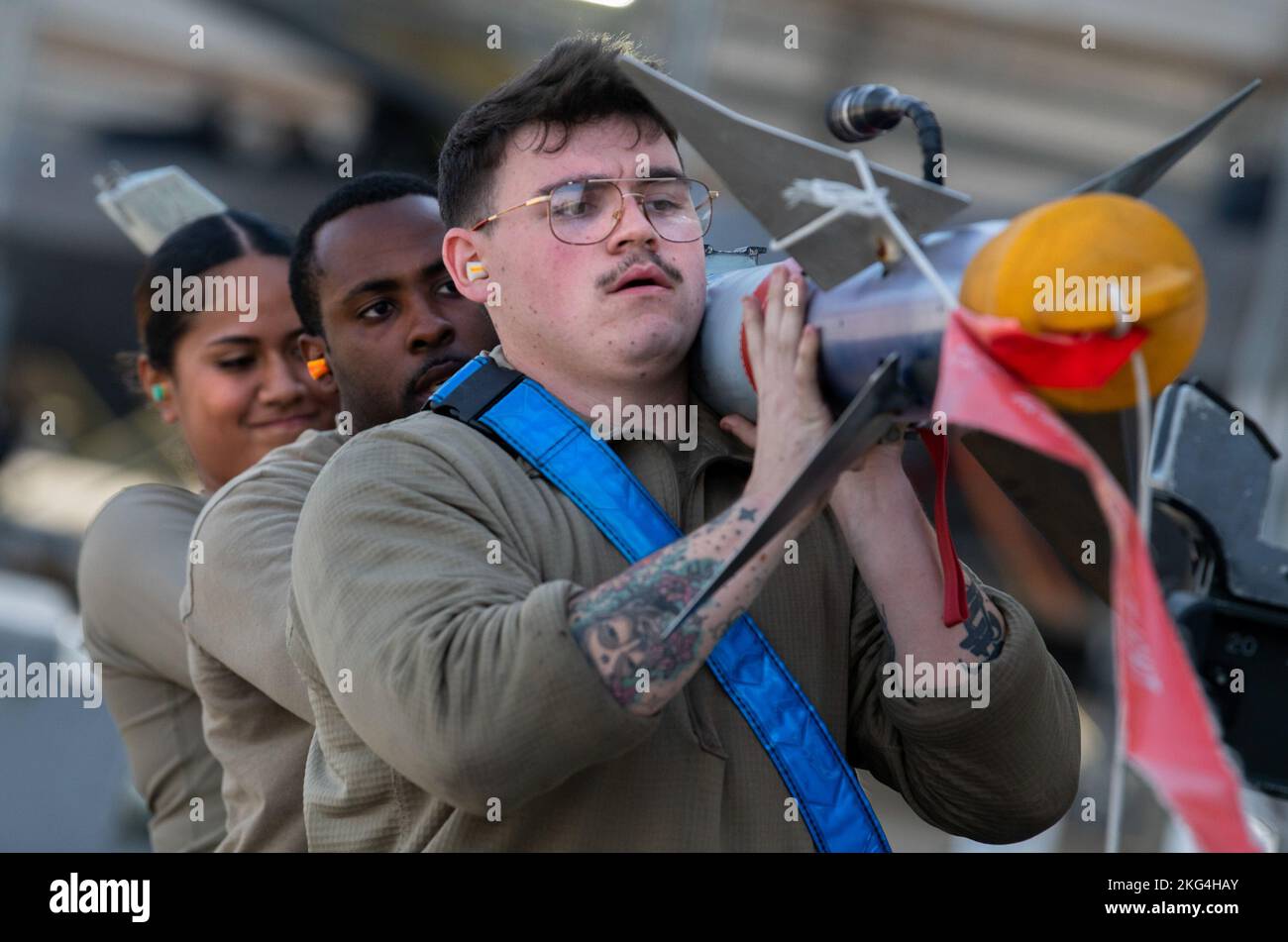 A 43rd Fighter Generation Squadron weapons load crew lifts an AIM-9 ...