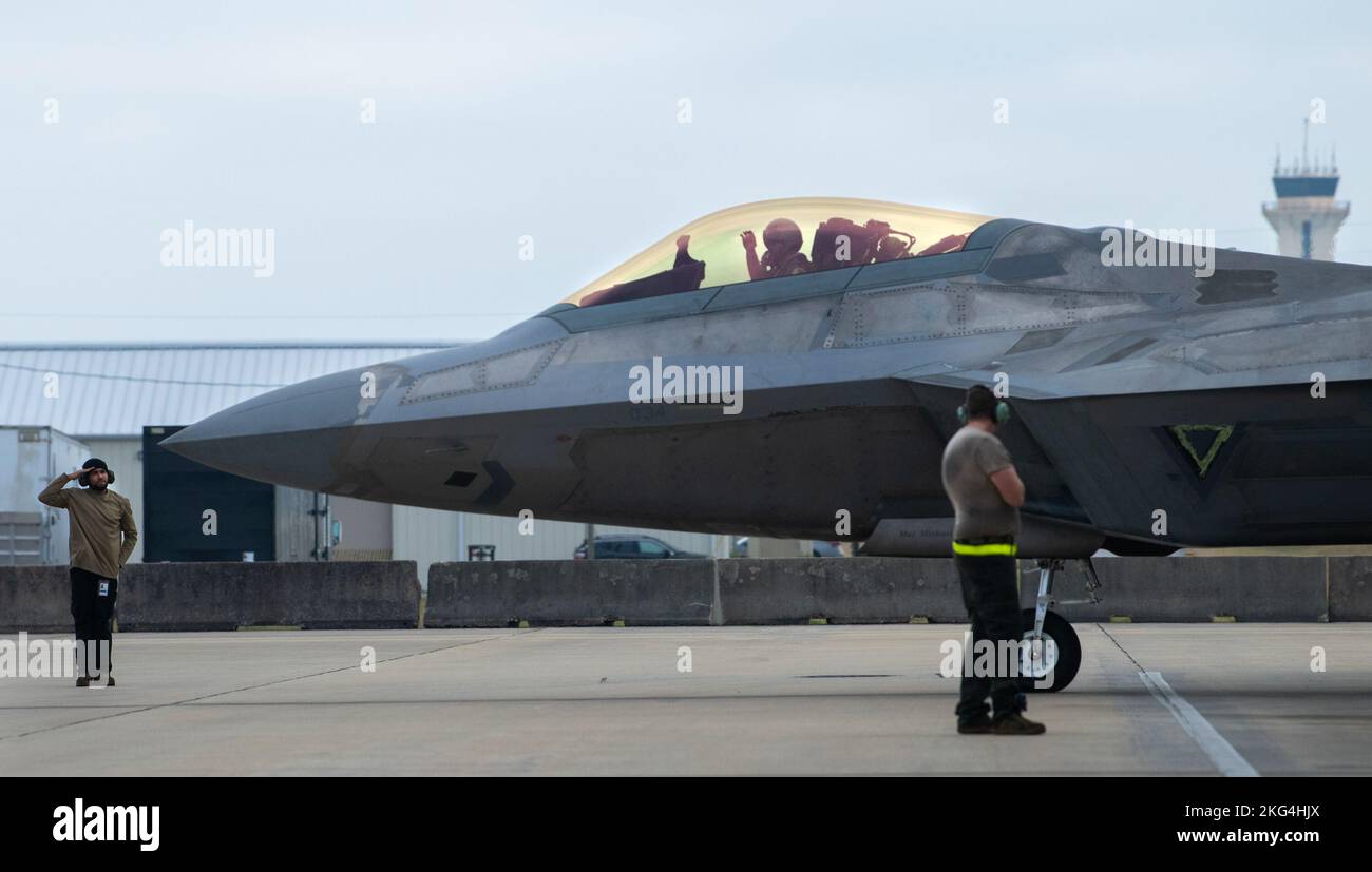 A 325th Fighter Wing maintainer renders a salute to an F-22A Raptor ...