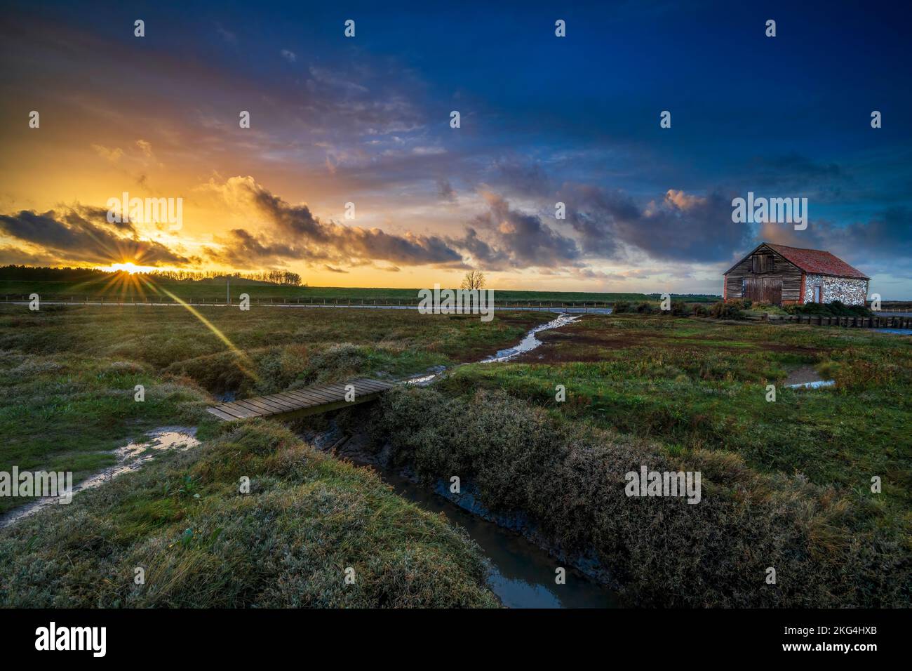 Coal shed on estuary at Thornham Old Harbour at sunset, Thornham ...