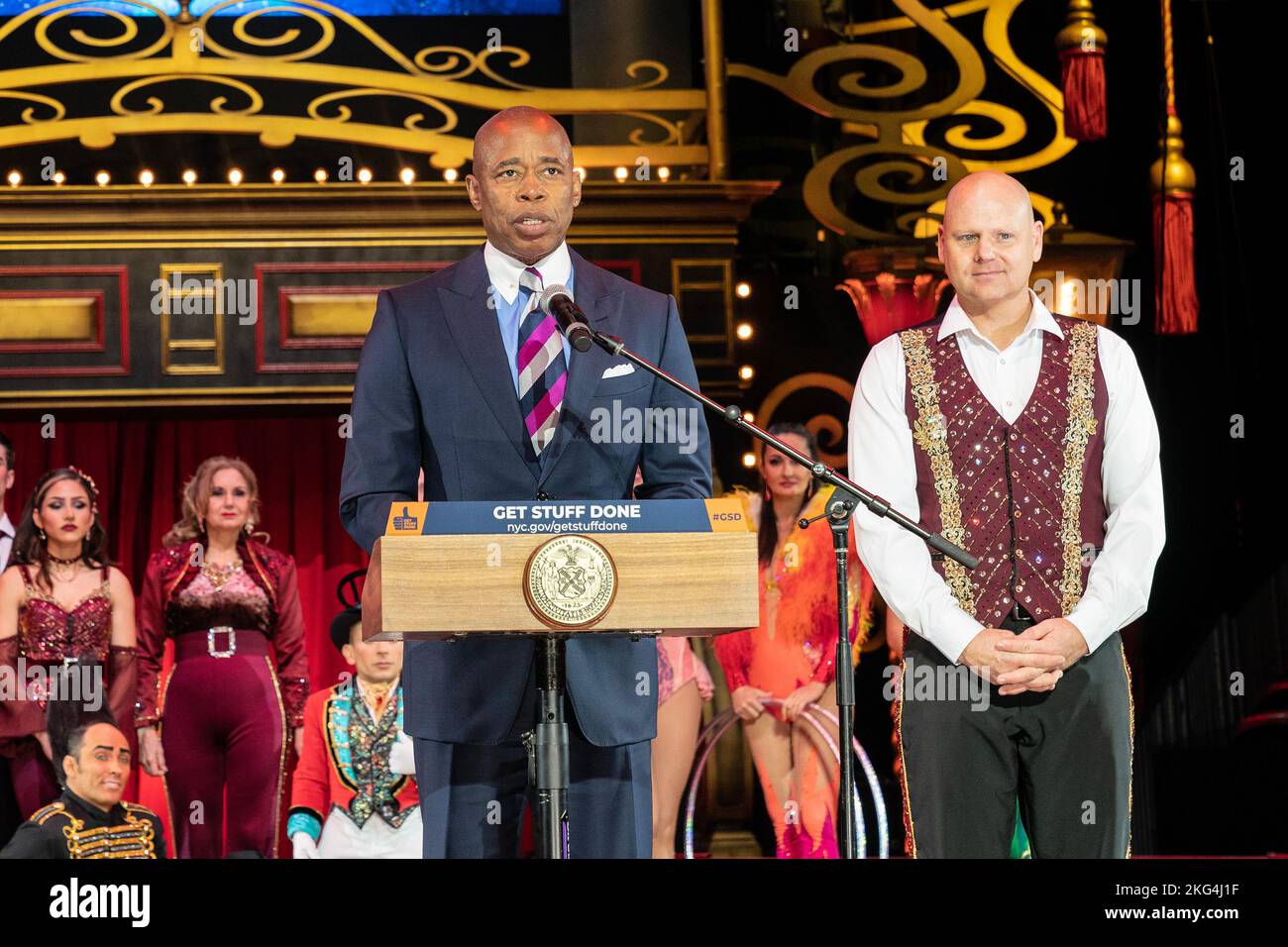 Mayor Eric Adams makes an announcement under the tent at Damrosch Park ...