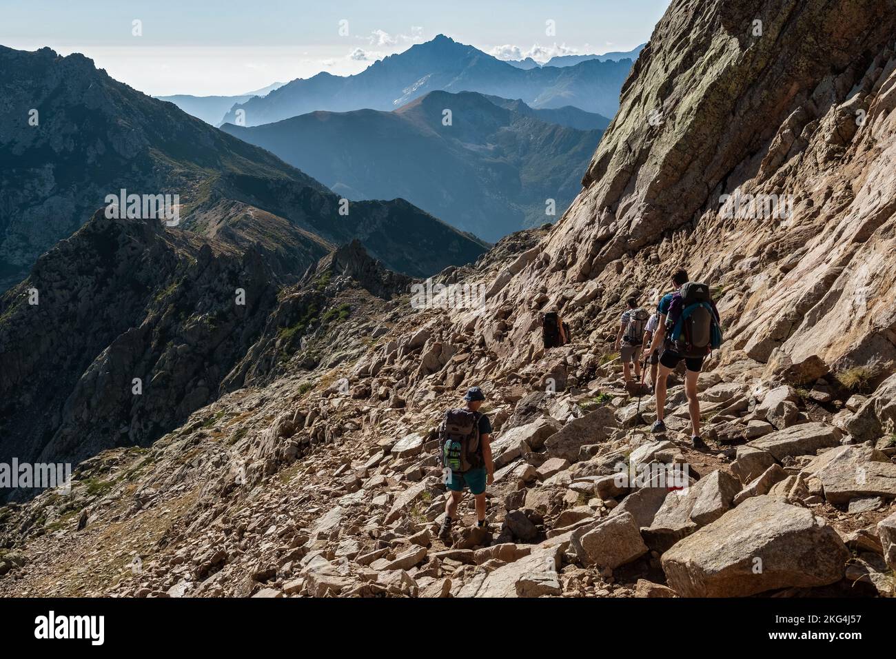 Hikers starting the descent from Bocca alle Porte, GR20, Corsica ...