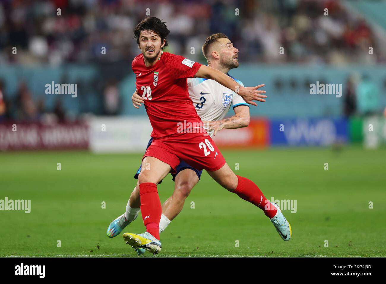 Al Rayyan, Qatar. 21st Nov, 2022. (L to R) Sardar Azmoun (IRI), Luke ...
