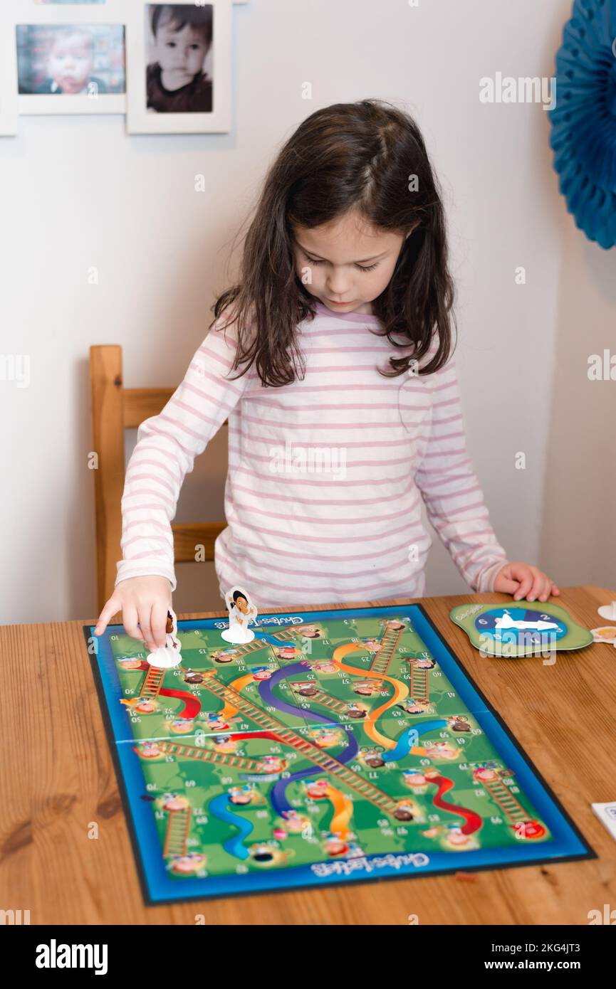 Girl playing board game hi-res stock photography and images - Alamy
