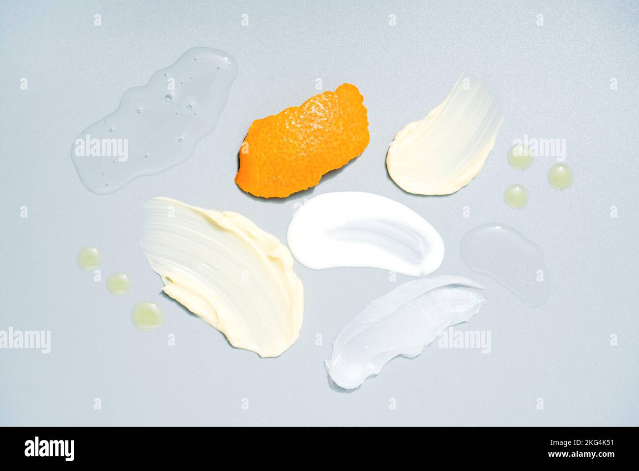Many cosmetic products samples with vitamin C - cream and gel smears ...