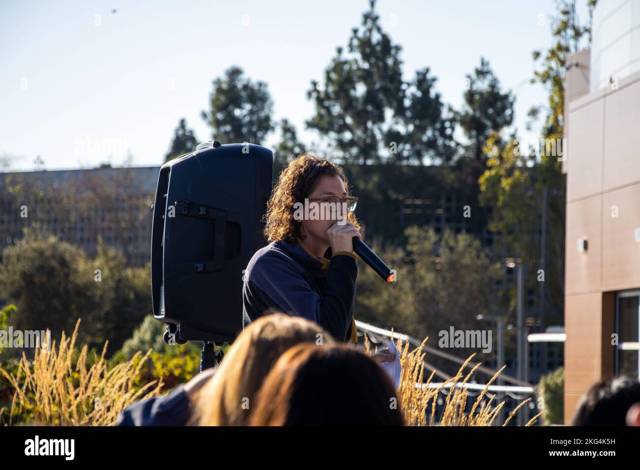 School assembly speaker with confidence in daylight outside Stock Photo ...