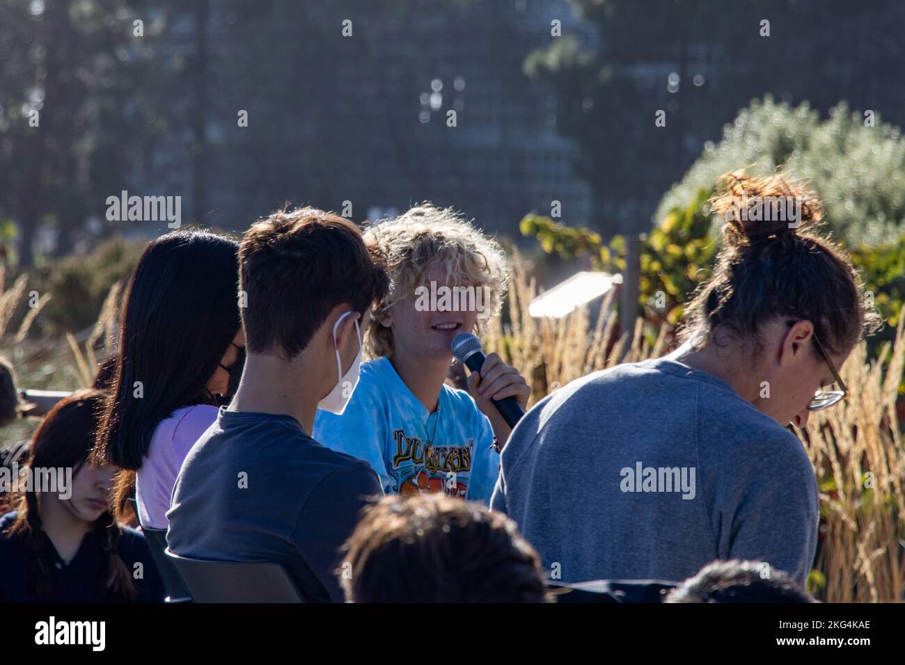 School assembly speaker with confidence in daylight outside Stock Photo ...