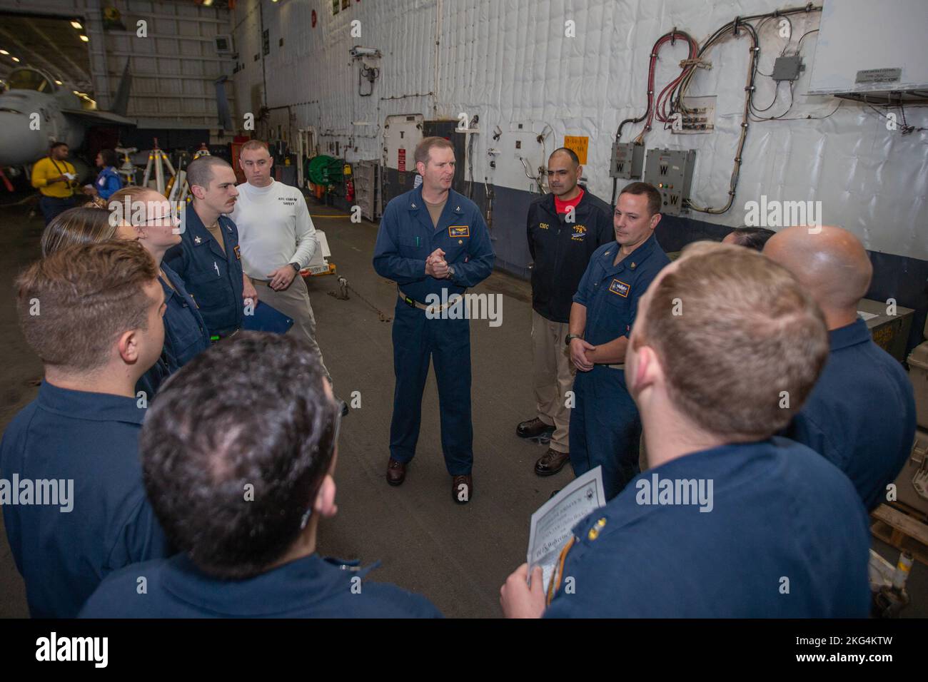 Capt. Matthew Mulcahey, center, the first-in-class aircraft carrier USS ...