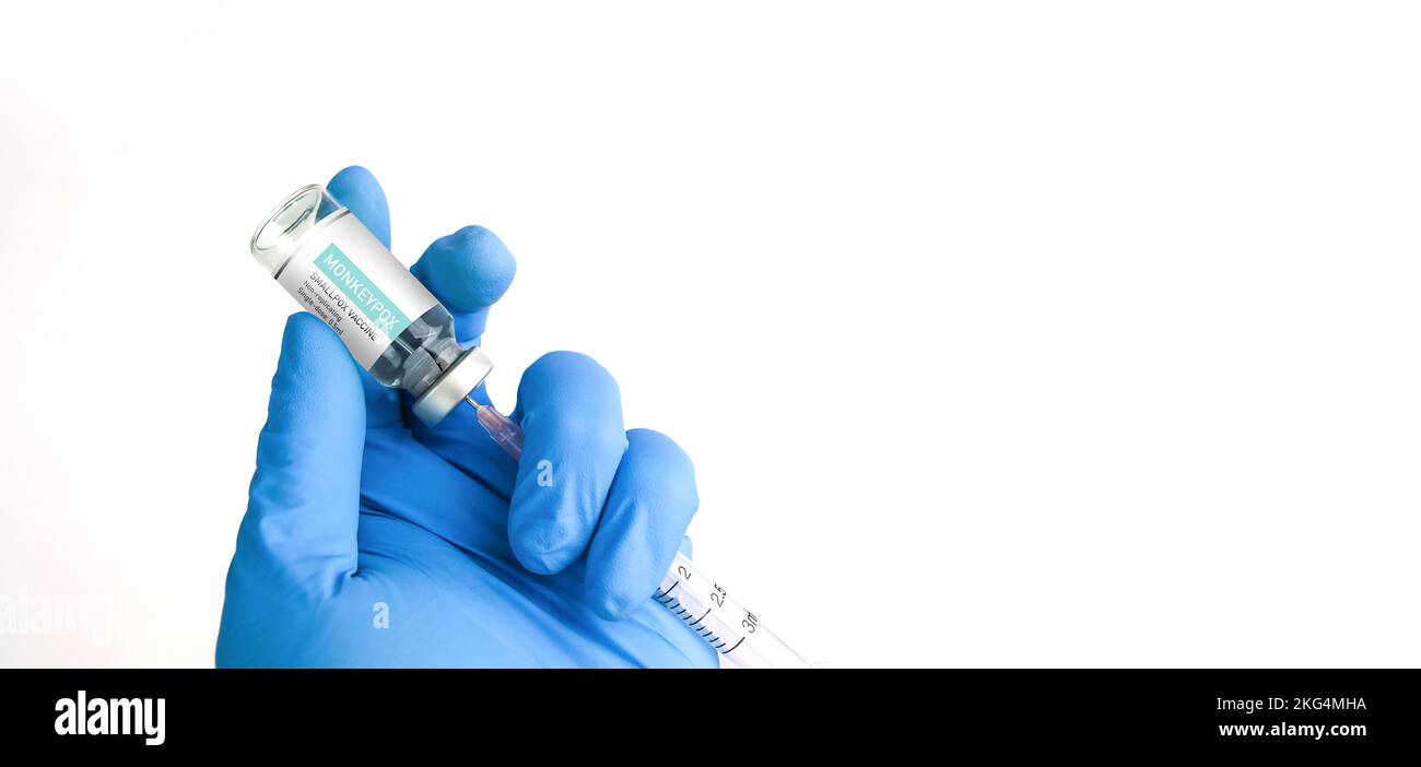 A doctor hand fills a syringe with monkeypox and a smallpox vaccine ...