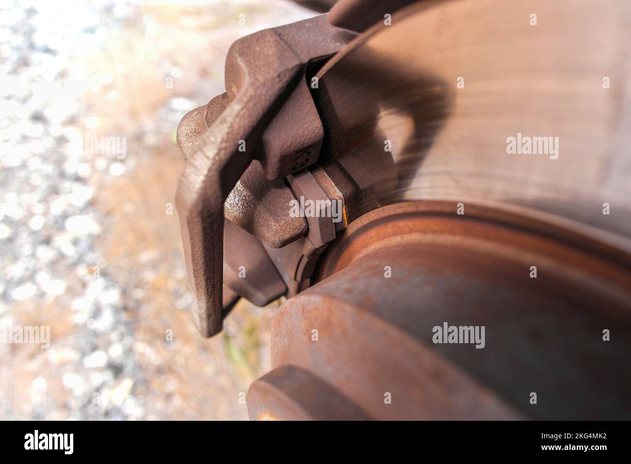 Old brake pads in worn car brake systems Stock Photo - Alamy